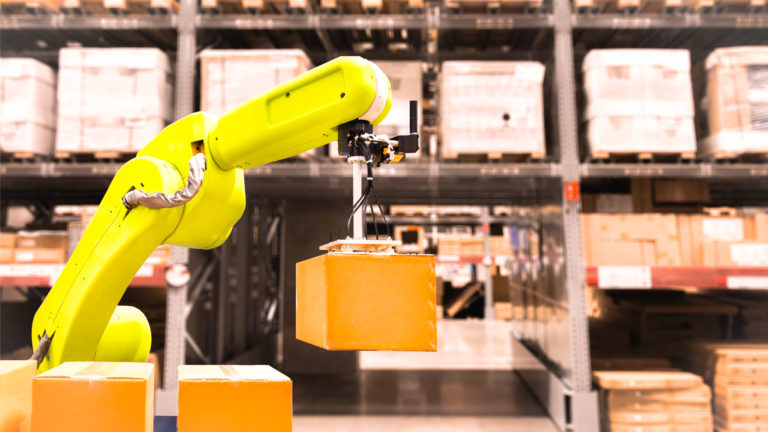 Industrial robot holding a box operating - RoboDK blog