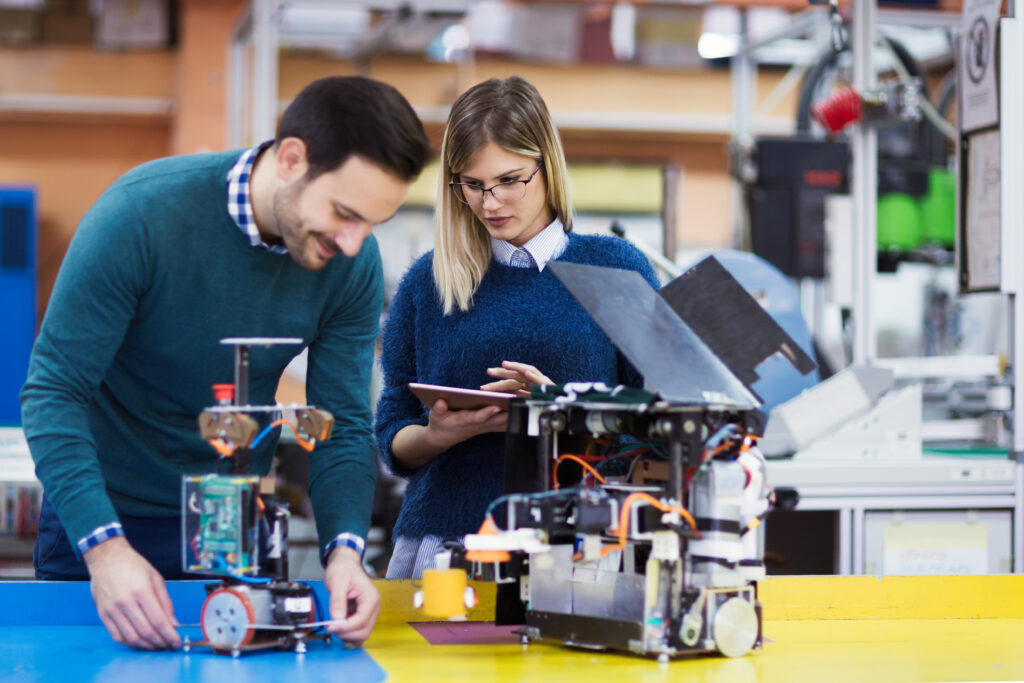 Young students of robotics working on project - RoboDK blog